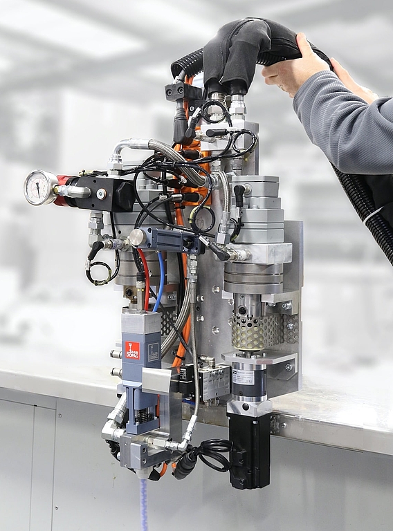 Metering and mixing system for adhesive bonding of automotive ...